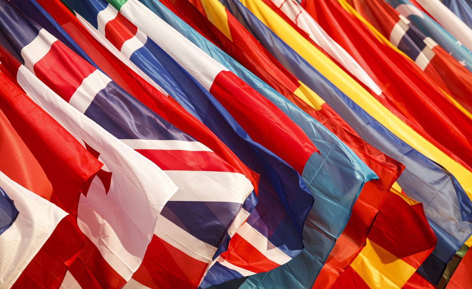 Closeup of a variety of national flags - The Bespoke Group